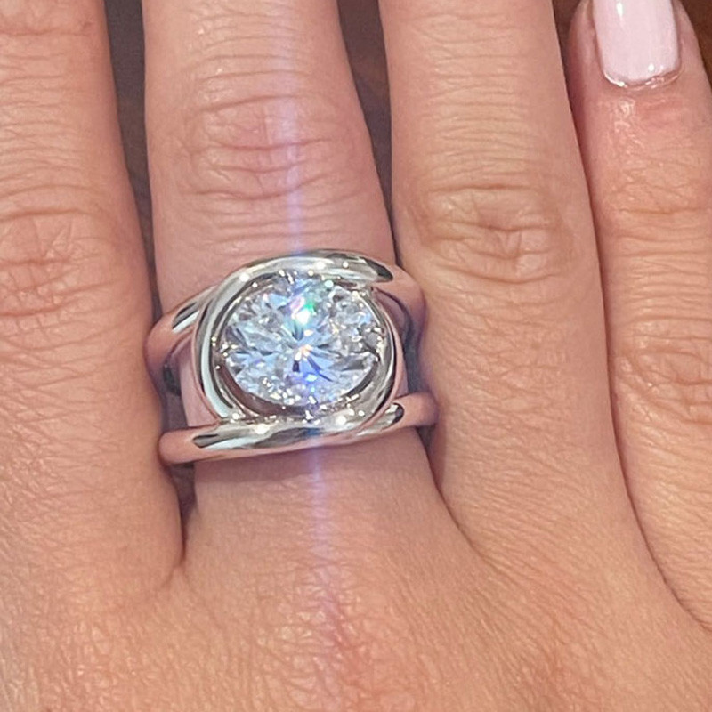 5.8ct Oval Cut White Sapphire Interlocking Loops Ring | SayaBling